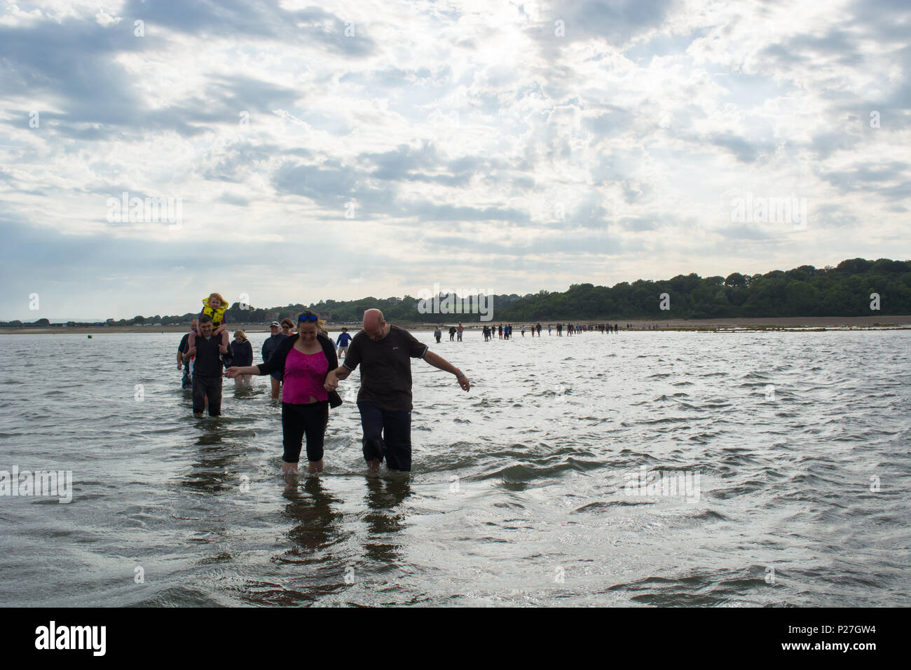 Participants at the Bembriudge and St Helens Annual Fort Walk, wading ...