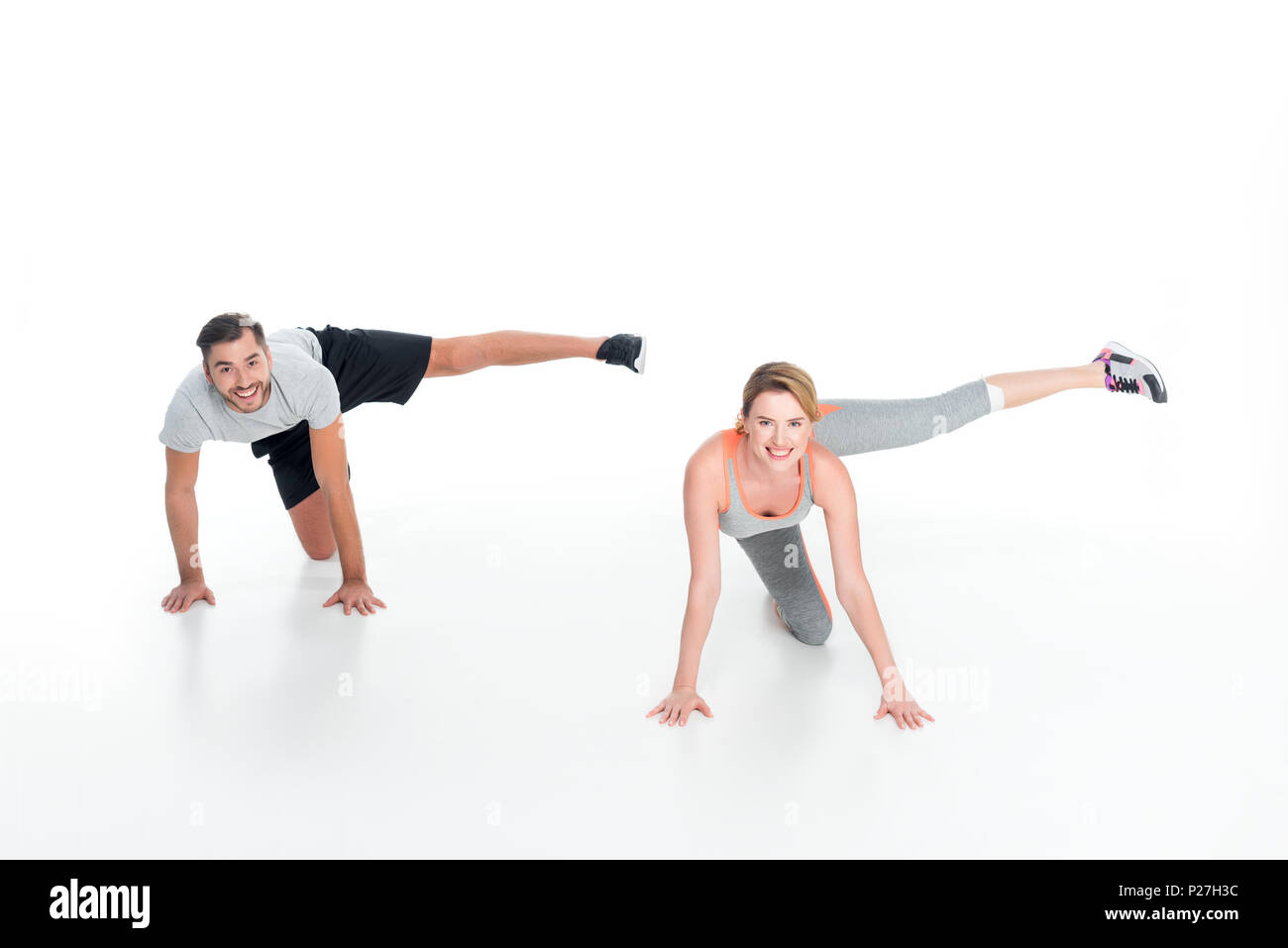 sportive couple exercising together isolated on white Stock Photo - Alamy