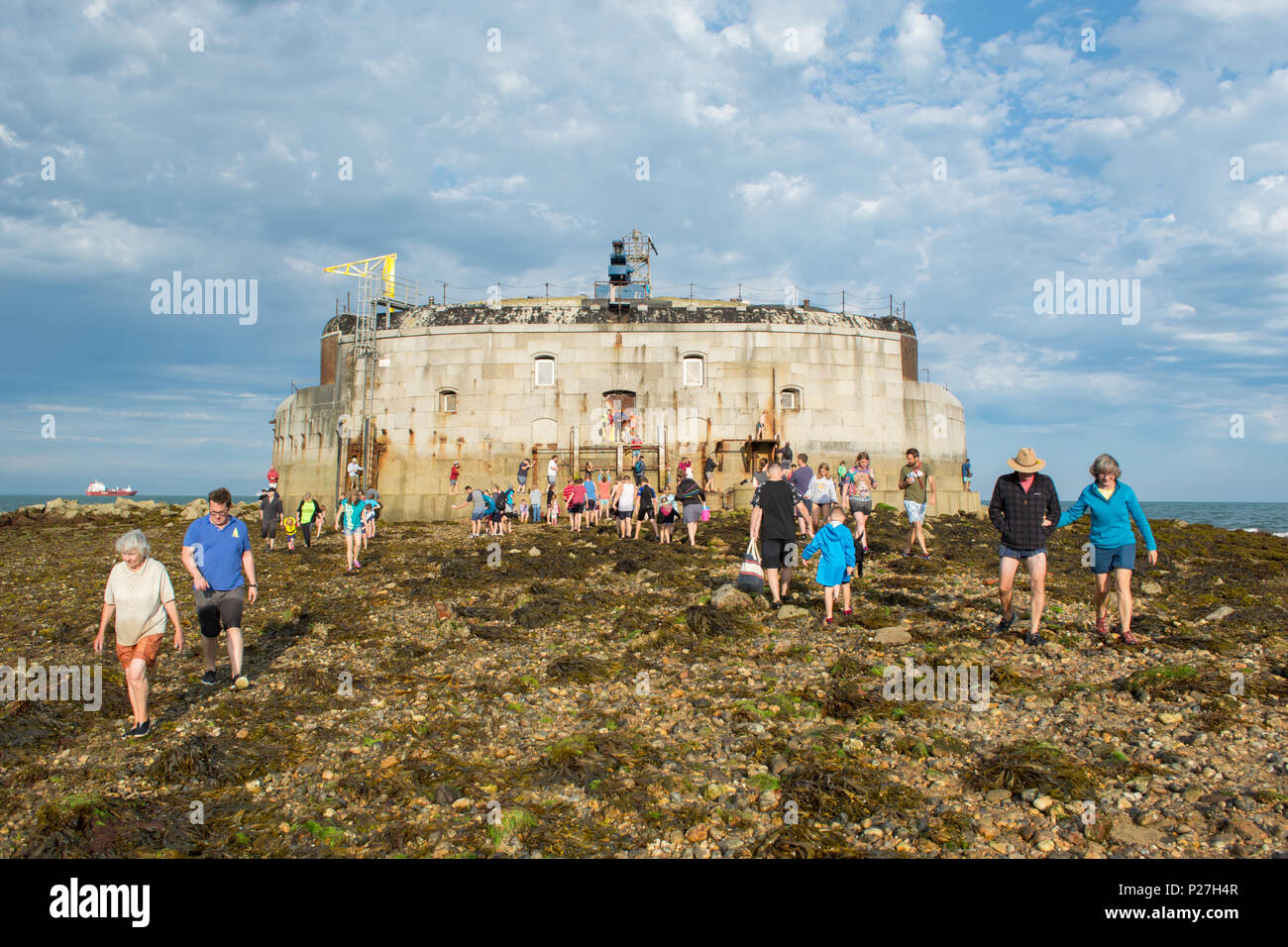 People walking the elevated causeway out to the Solent Fort at the ...