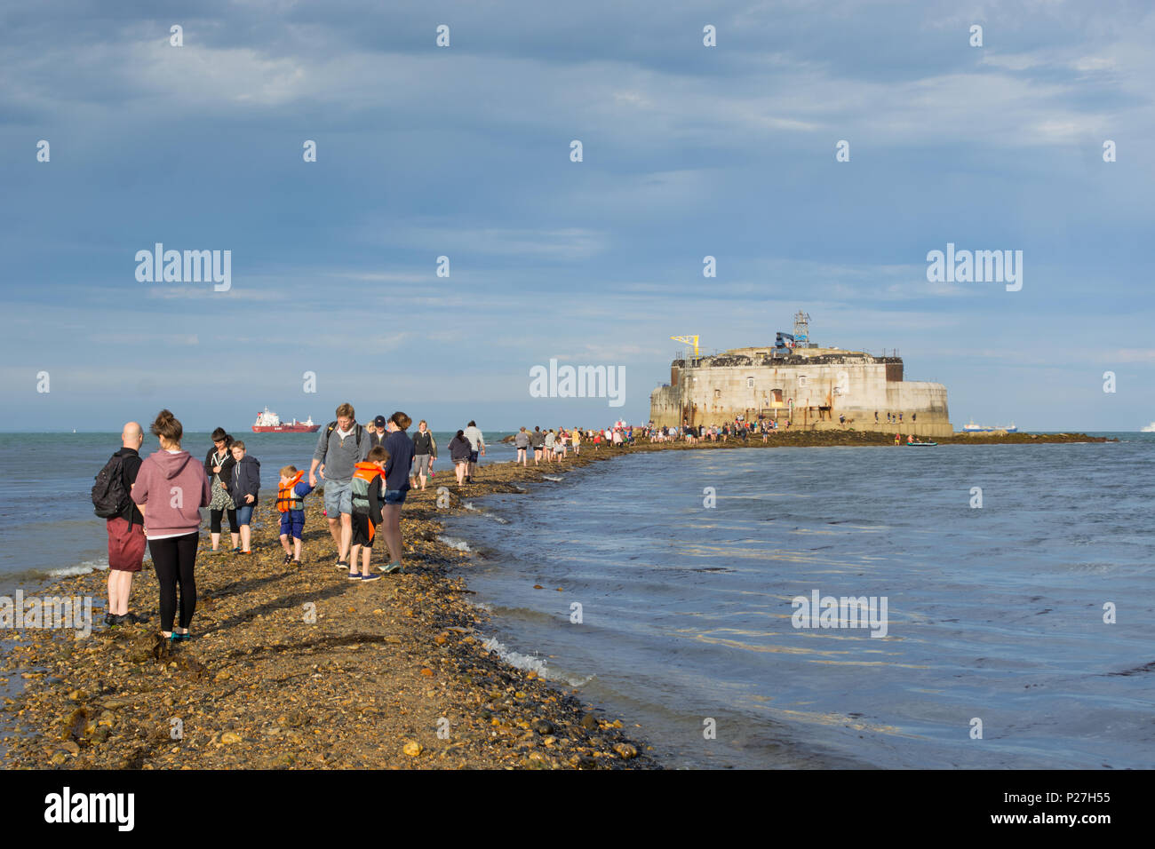 People walking the elevated causeway out to the Solent Fort at the ...