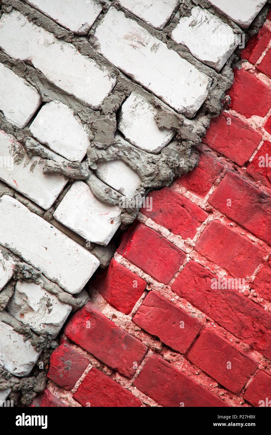 Brick old wall divided into two parts white and red , texture grunge ...