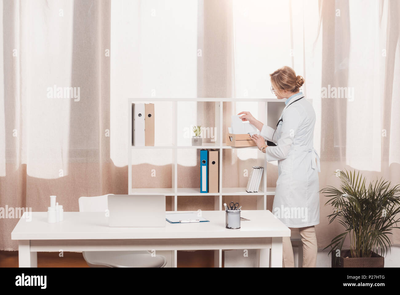 side view of doctor in white coat working with blanks in clinic Stock ...