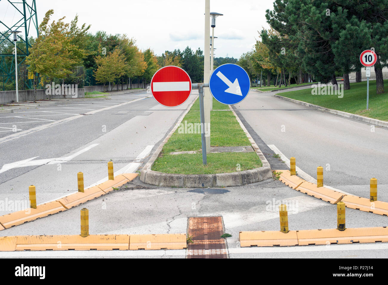 empty street with focus on drive direction signs Stock Photo - Alamy