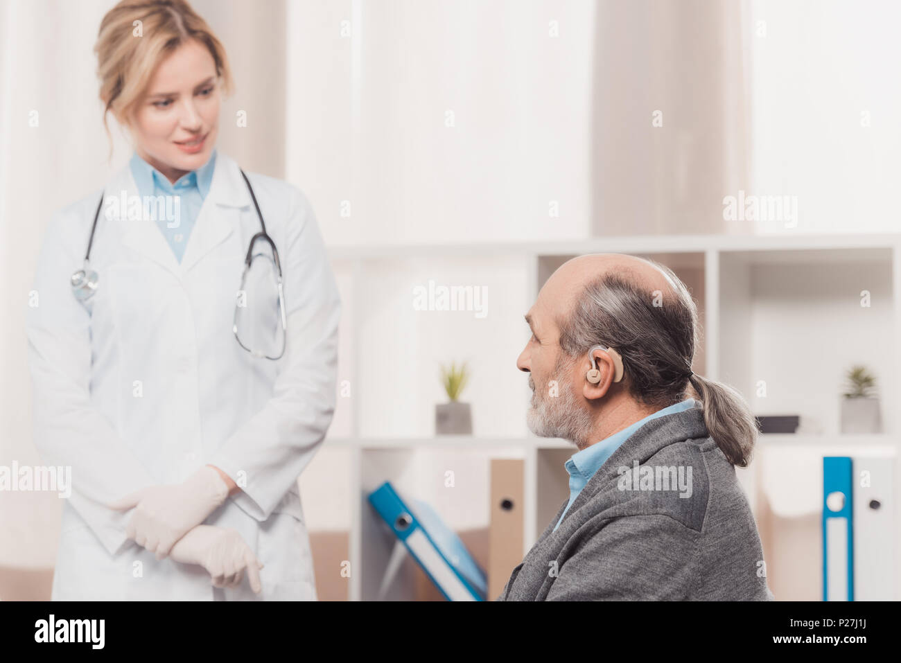 Deaf aid hi-res stock photography and images - Alamy