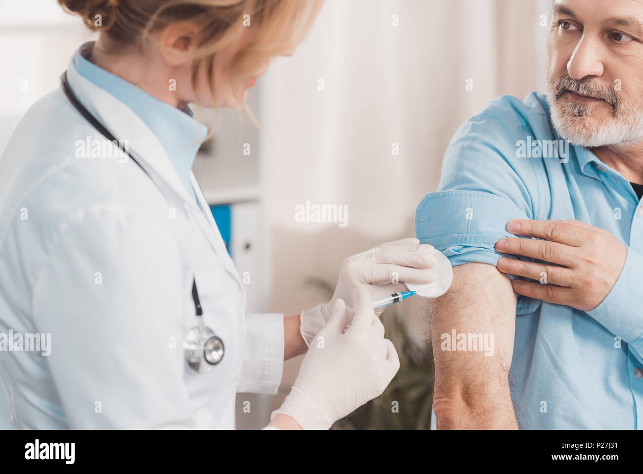 Professional doctor making injection caucasian hi-res stock photography and images - Alamy