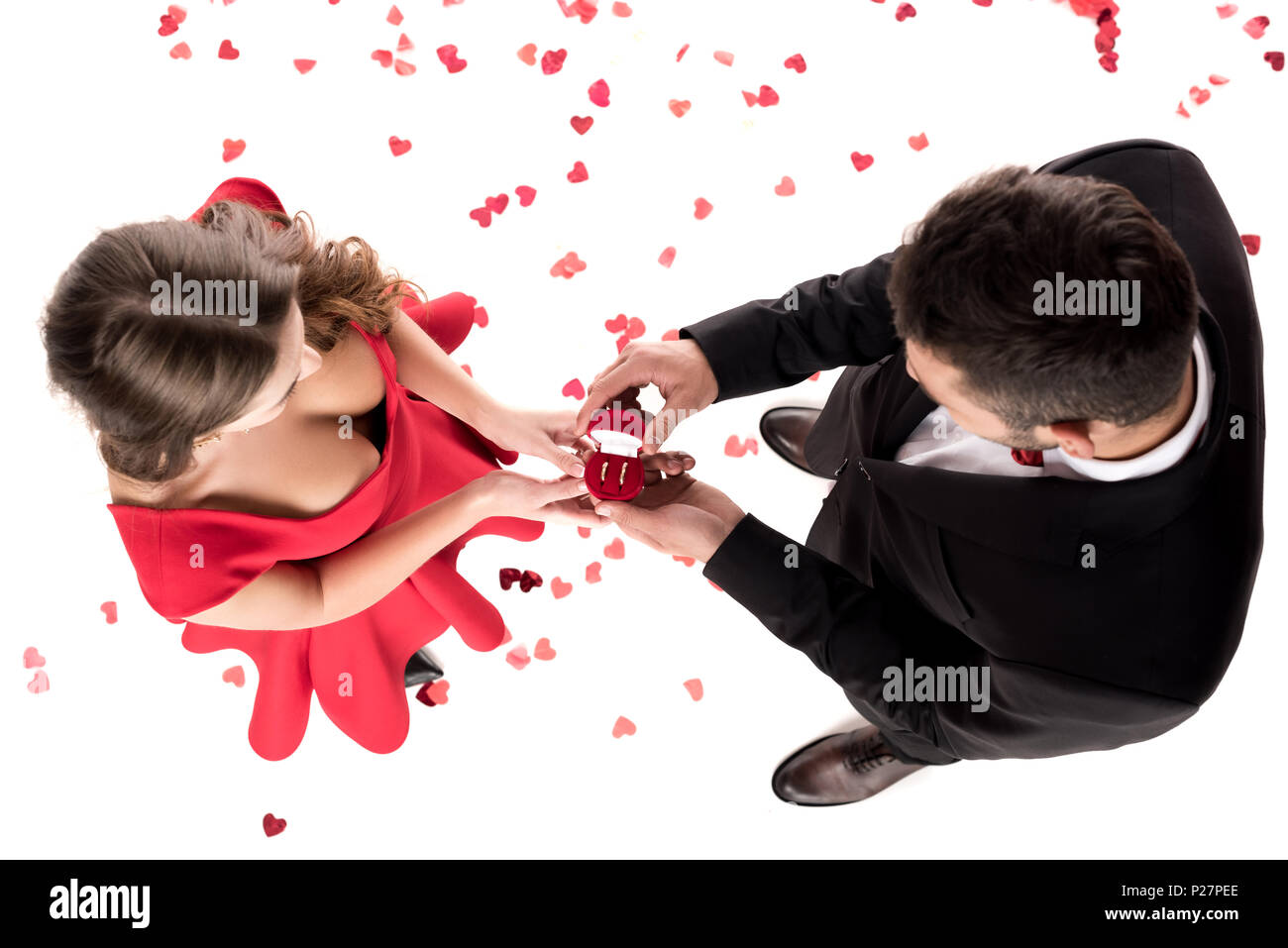 overhead view of boyfriend proposing girlfriend isolated on white ...