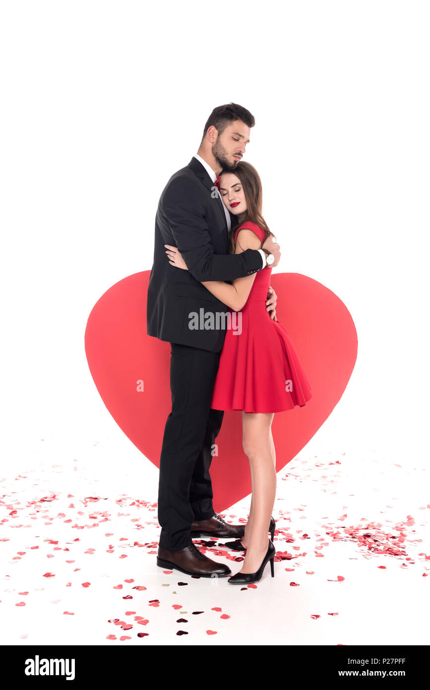 couple hugging near big heart on white, valentines day concept Stock ...