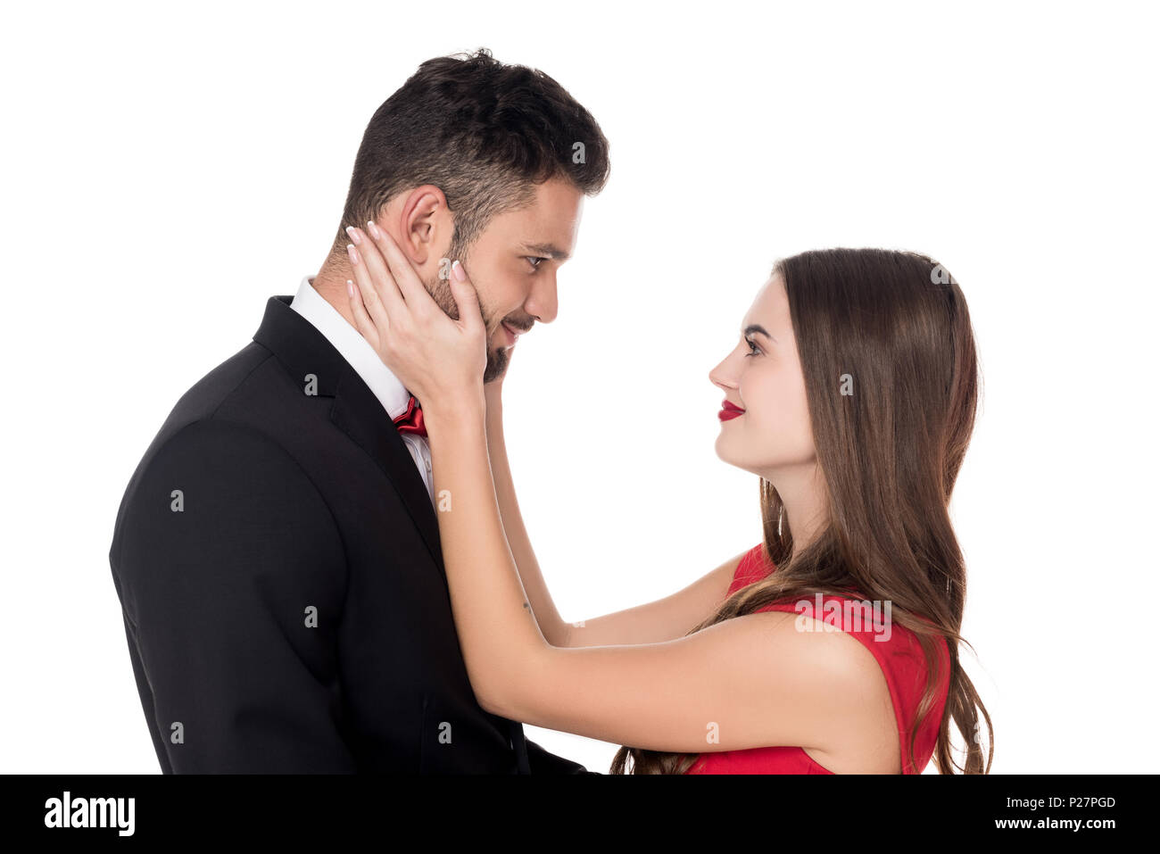 side view of girlfriend touching boyfriends face isolated on white ...