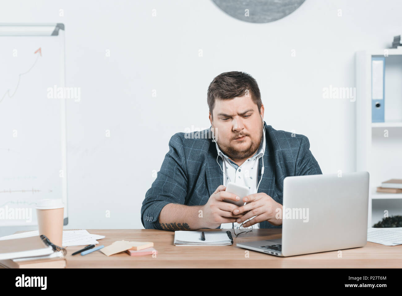 Overweight businessman listening music hi-res stock photography and ...