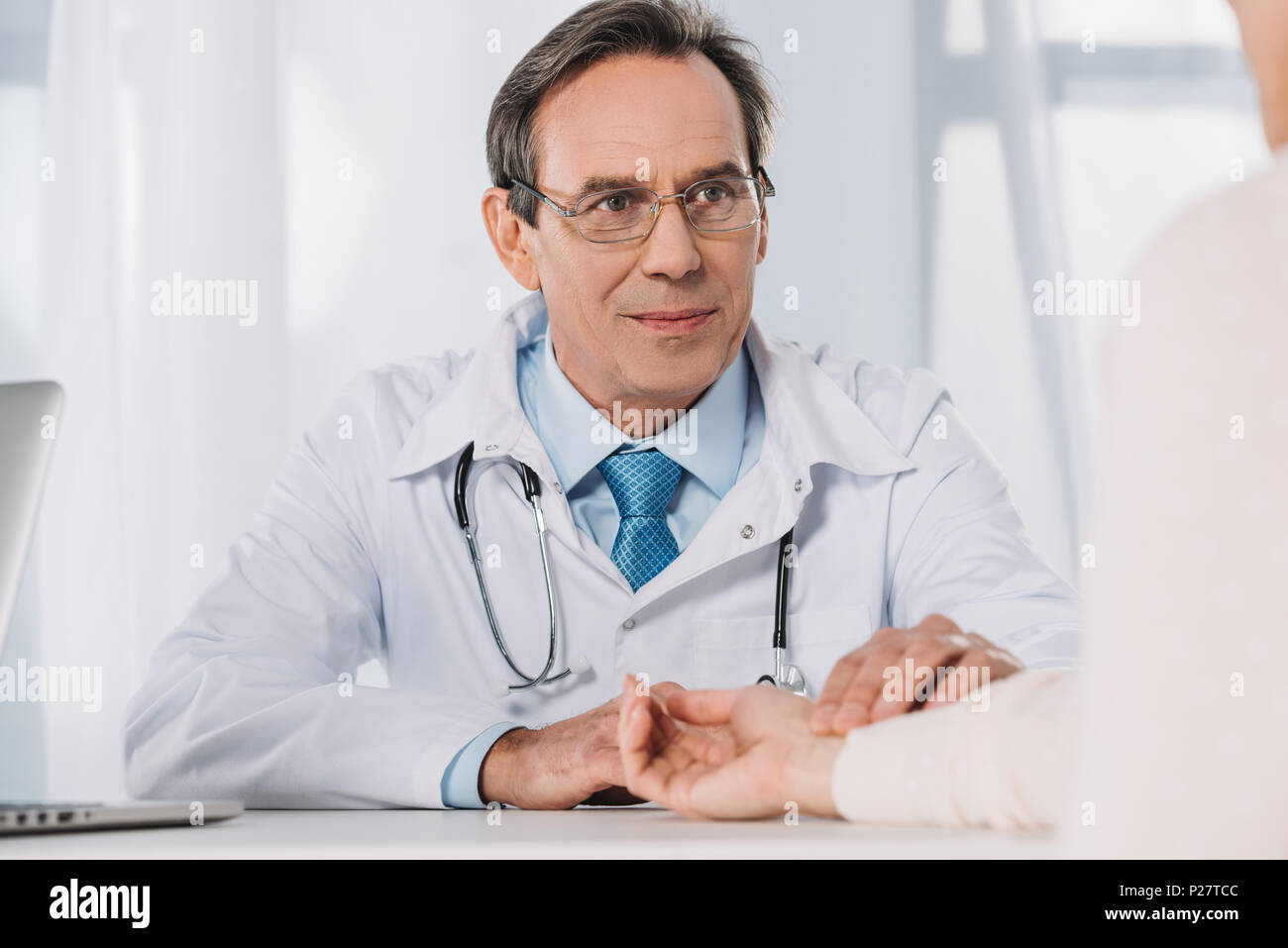 cropped image of doctor measuring patient pulse Stock Photo - Alamy