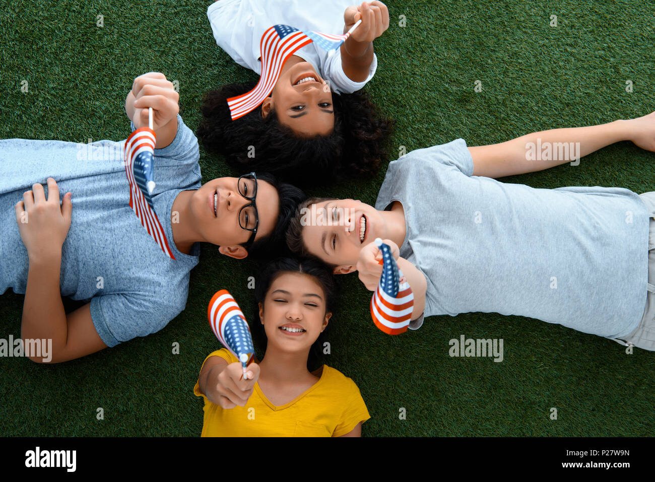top view of group of teen students with usa flags on green grass Stock ...