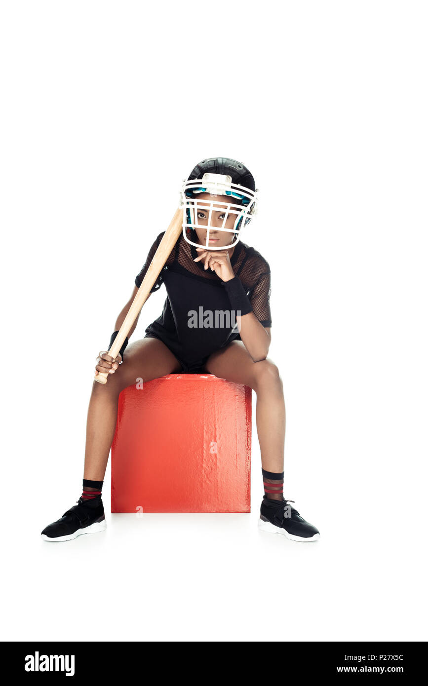 female baseball player with bat sitting on cube isolated on white Stock ...