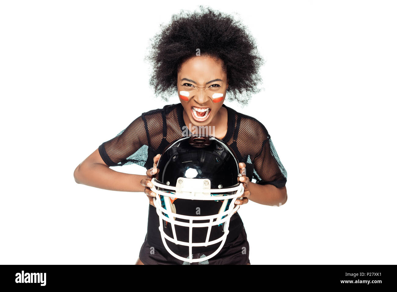 angry shouting female american football player with helmet in hands ...