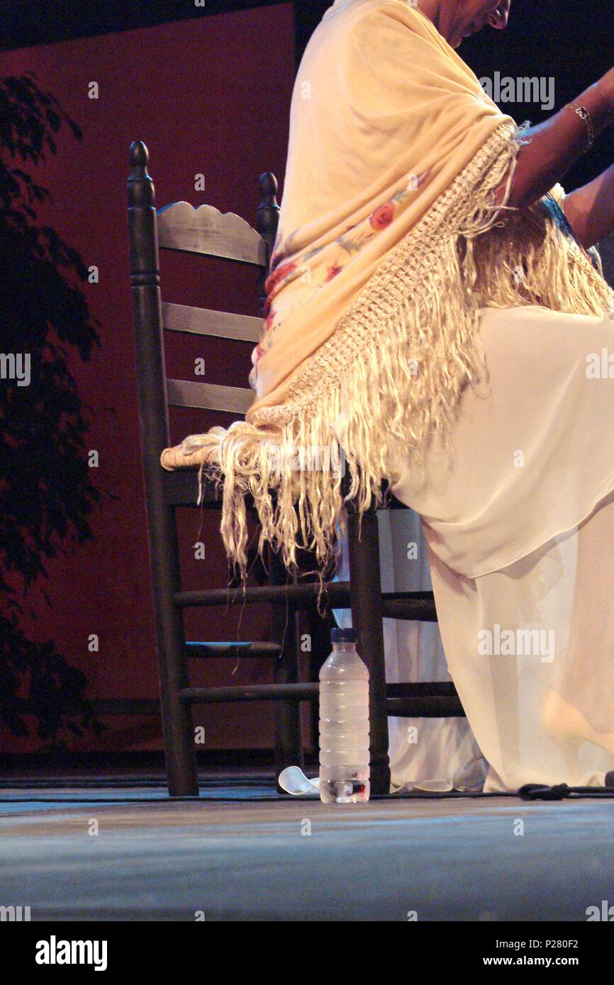 Flamenco singer on stage performing on a flamenco chair Stock Photo - Alamy