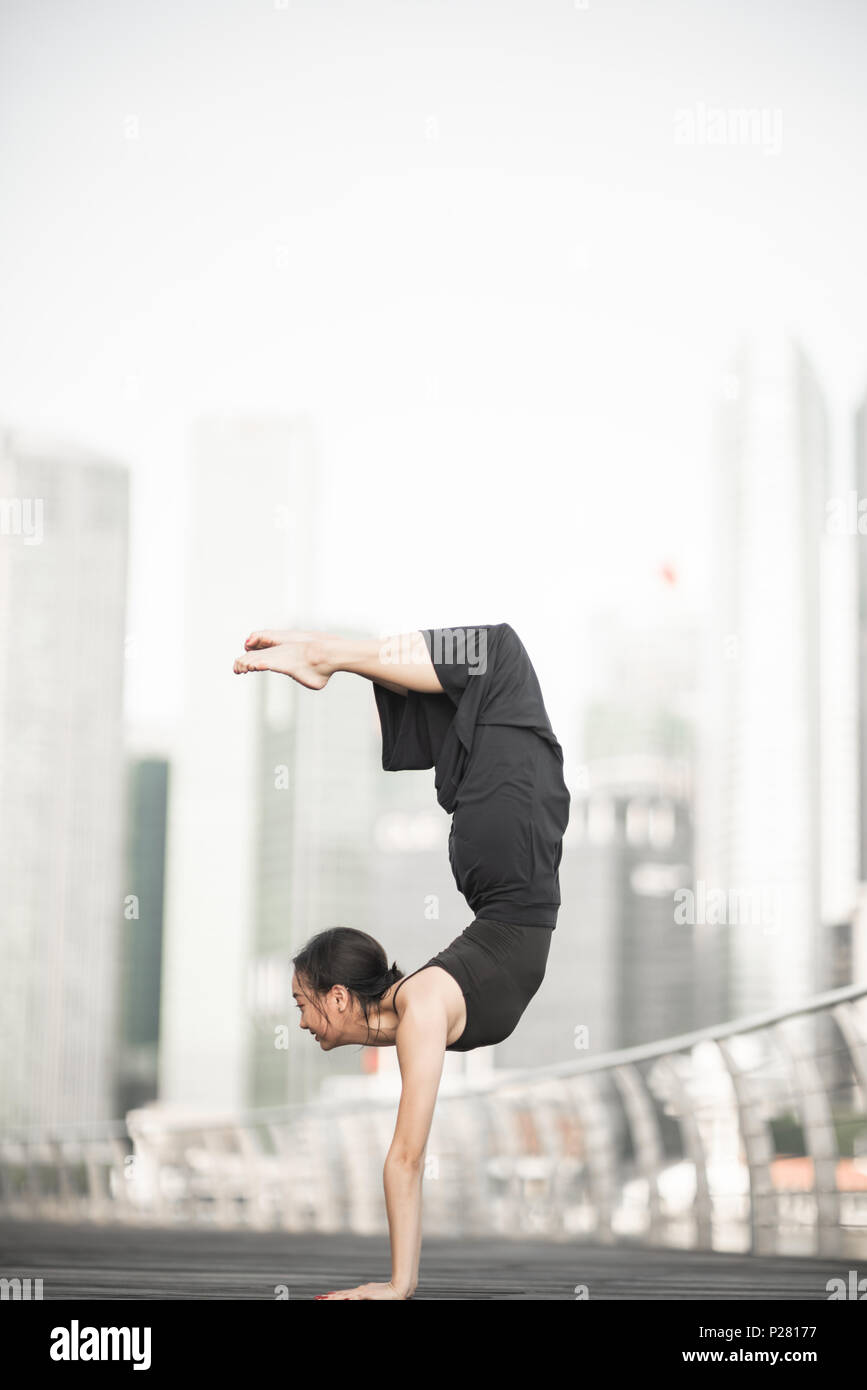Beautiful Young Girl Dancing on a bridge Stock Photo - Alamy
