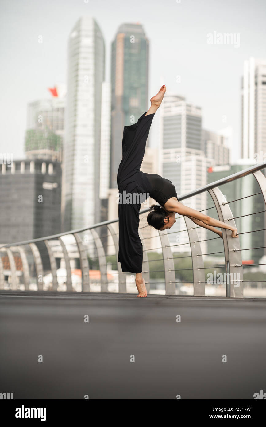 Beautiful Young Girl Dancing on a bridge Stock Photo - Alamy