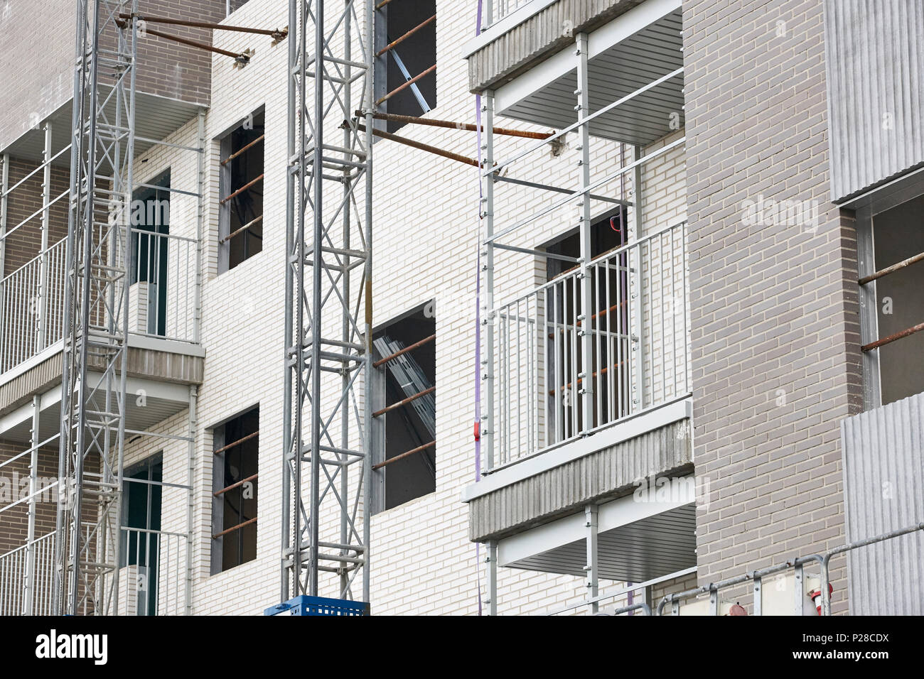 Building under construction. Brick facade structure. Architecture ...