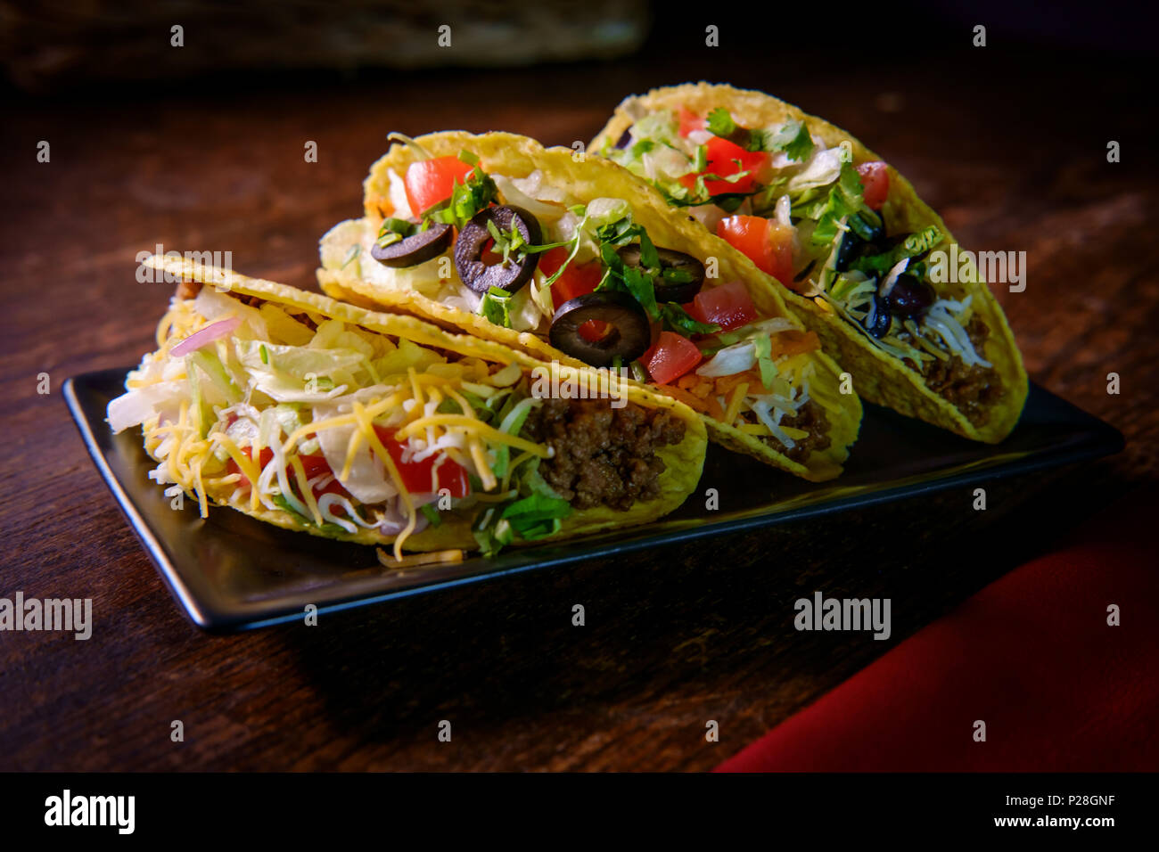 Mexican beef tacos loaded with toppings including olives shredded ...