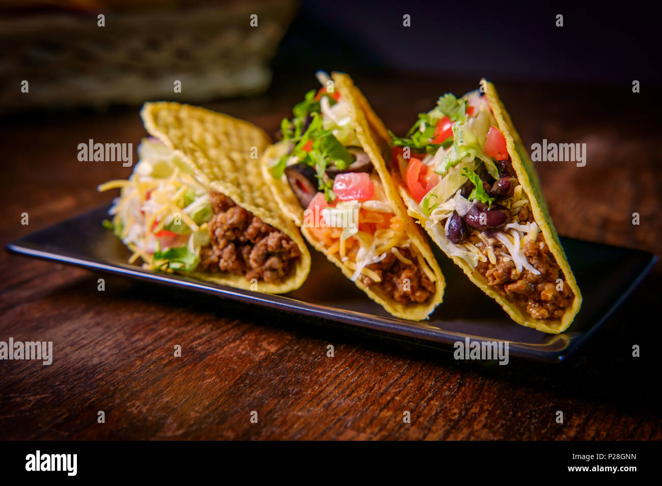 Mexican beef tacos loaded with toppings including olives shredded ...