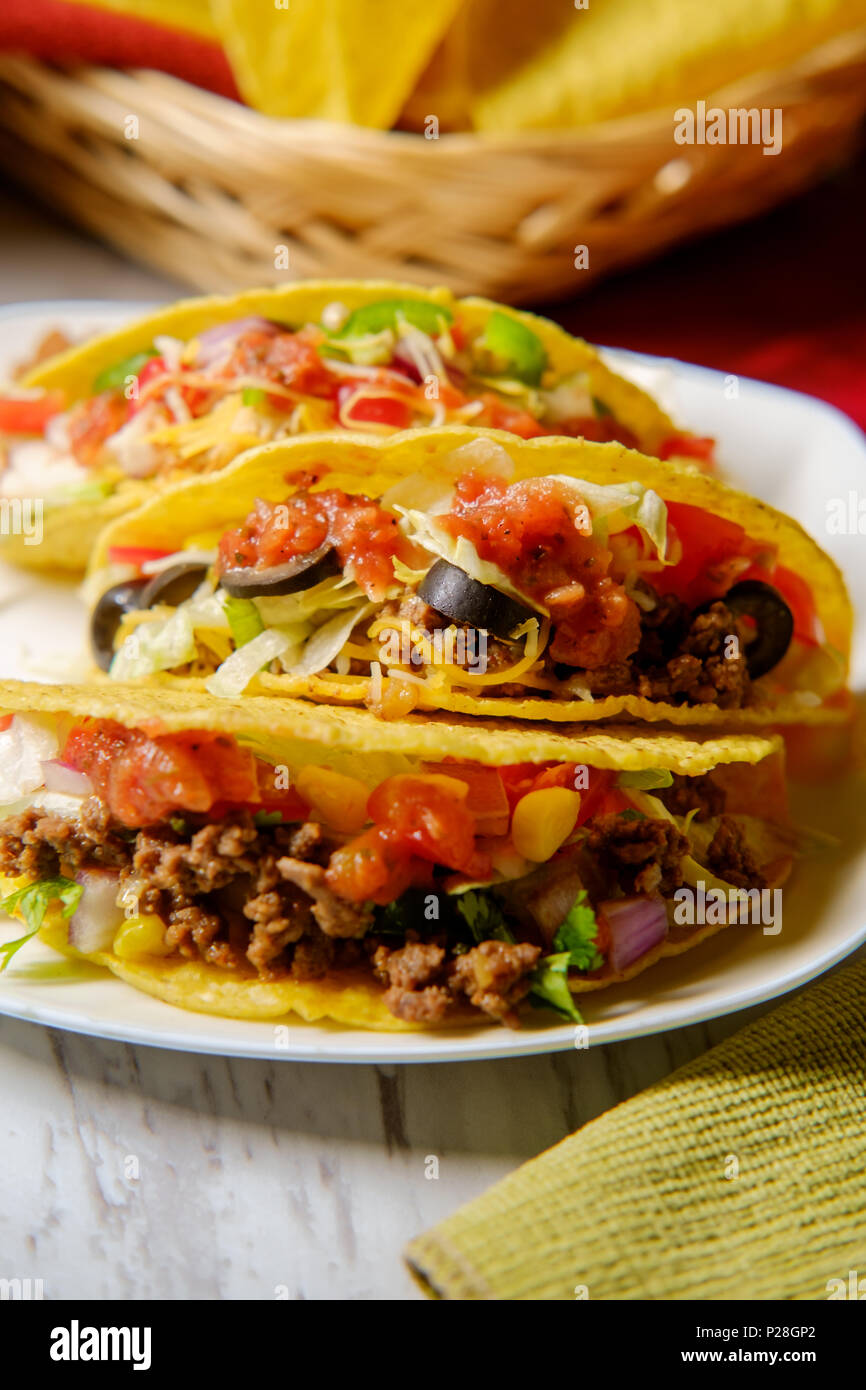 Mexican beef tacos loaded with toppings including olives shredded ...
