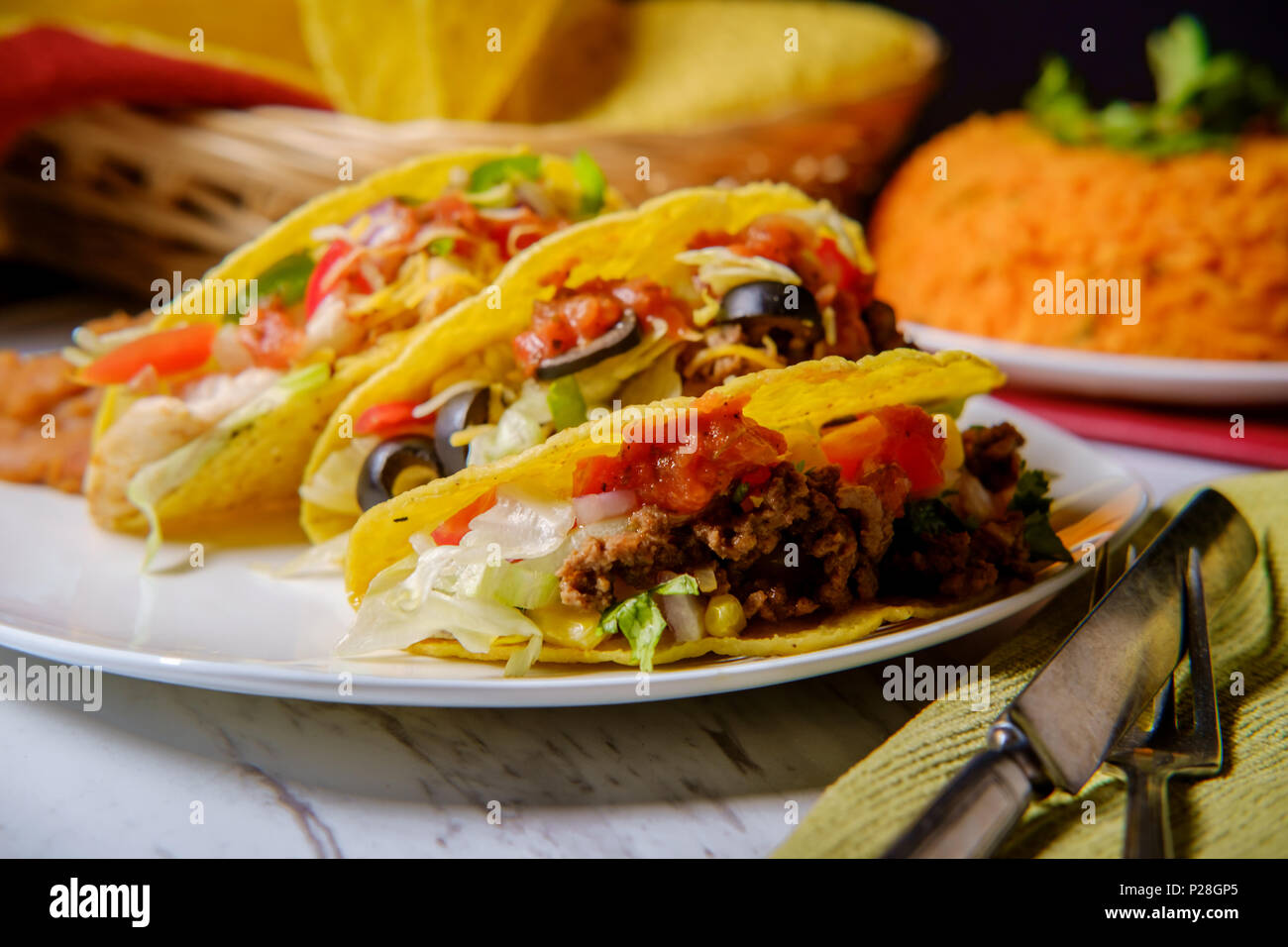 Mexican beef tacos loaded with toppings including olives shredded ...