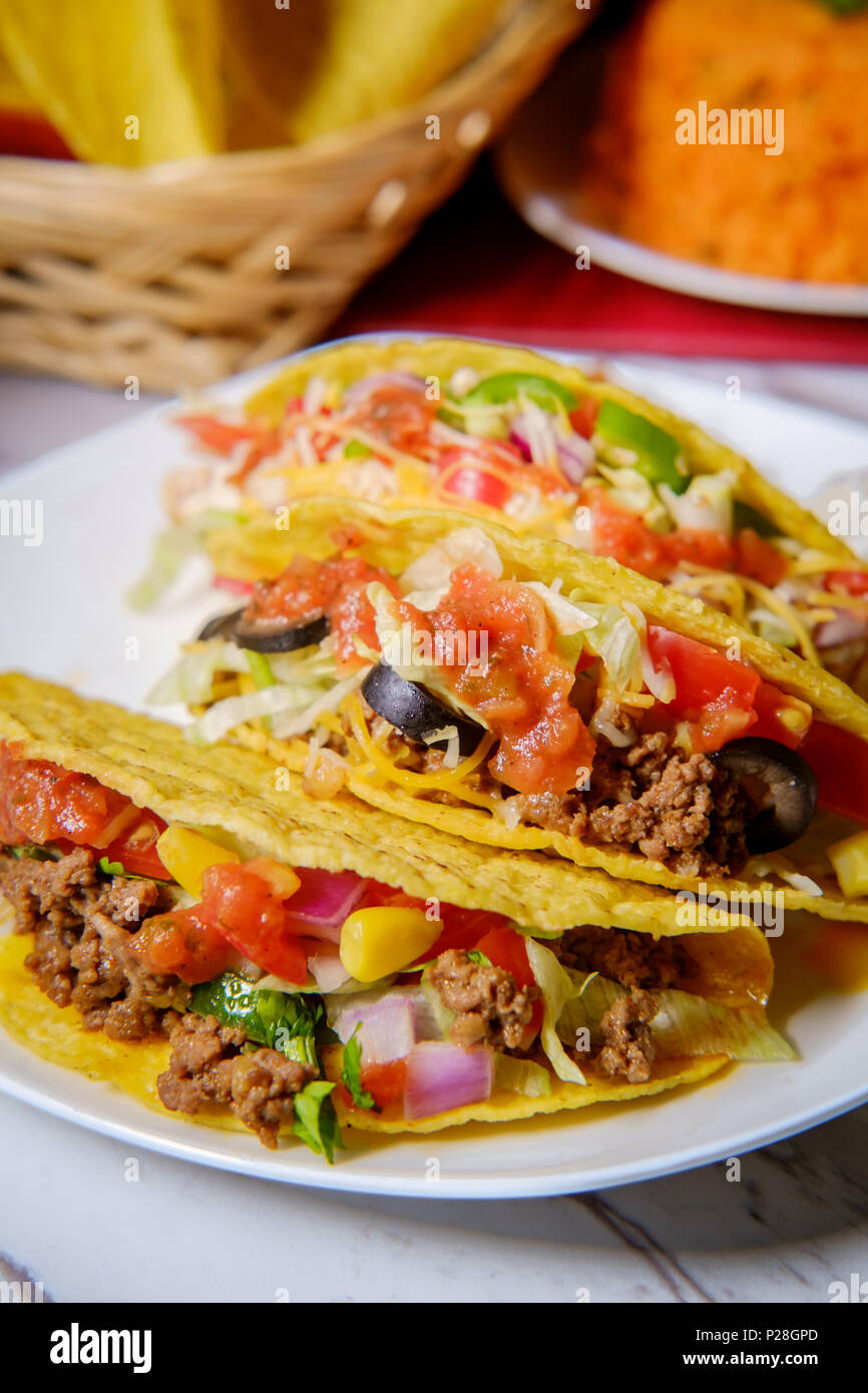 Mexican beef tacos loaded with toppings including olives shredded ...