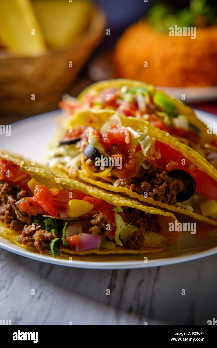 Mexican beef tacos loaded with toppings including olives shredded ...