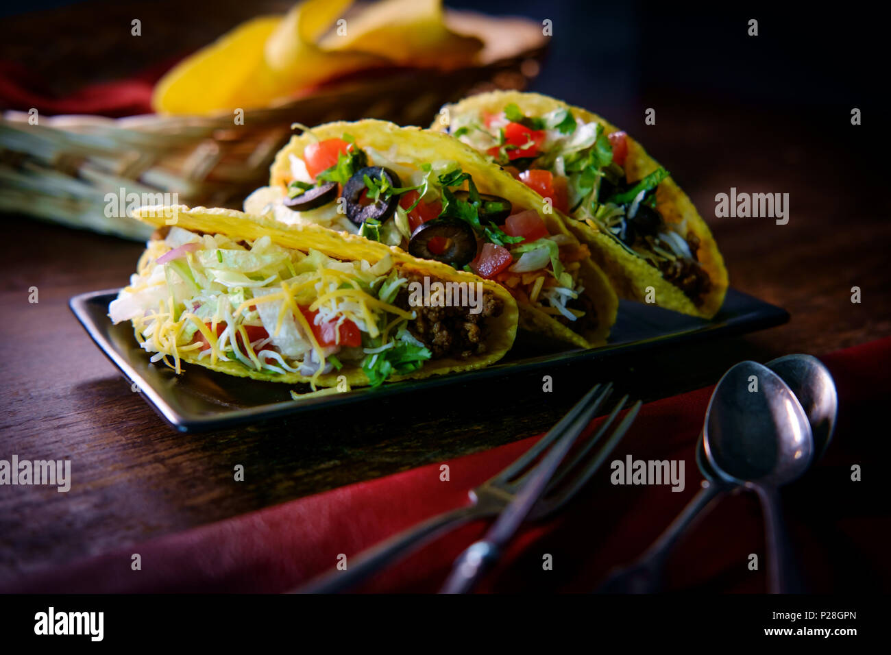 Mexican beef tacos loaded with toppings including olives shredded ...