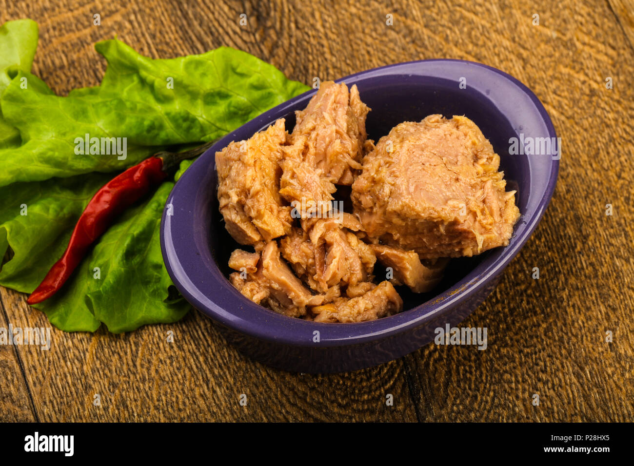 Canned tuna fish in the bowl ready for cooking Stock Photo - Alamy