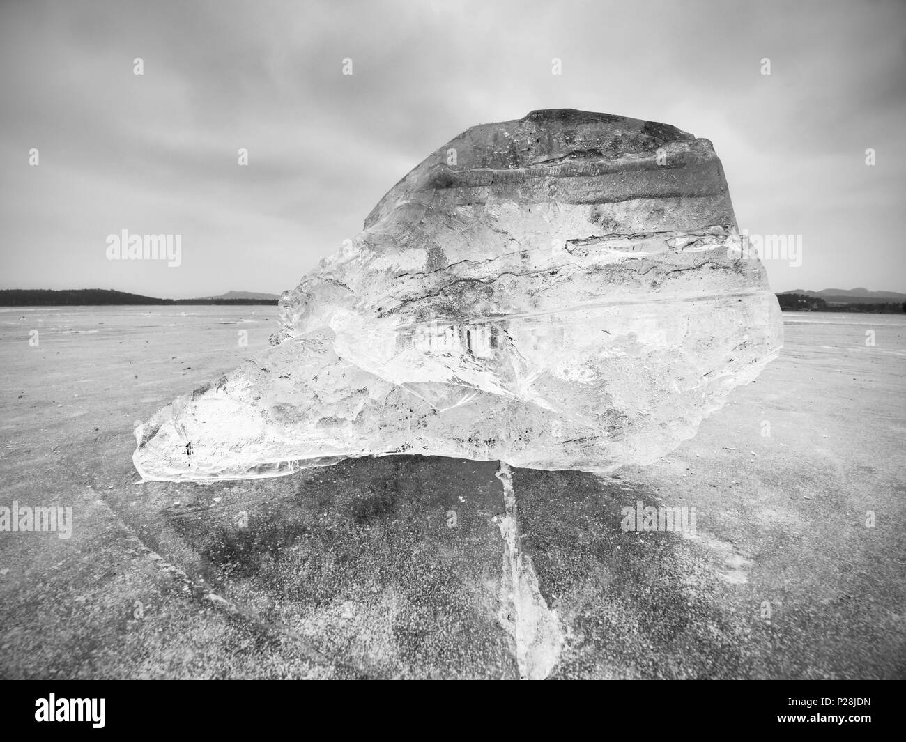 Ice floe and crushed ice on dark frozen and flat ground. Shining ...