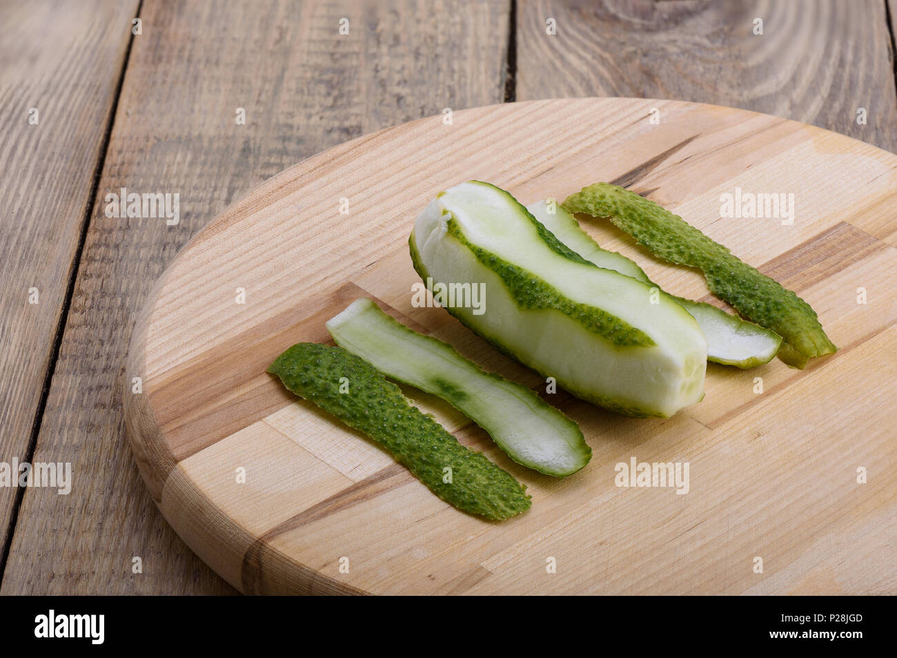 Rustic style. Fresh cucumber and peel of cucumber Stock Photo - Alamy