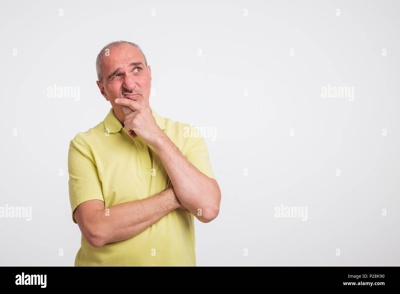 mature caucasian man thinking pensive looking up studio portrait Stock ...