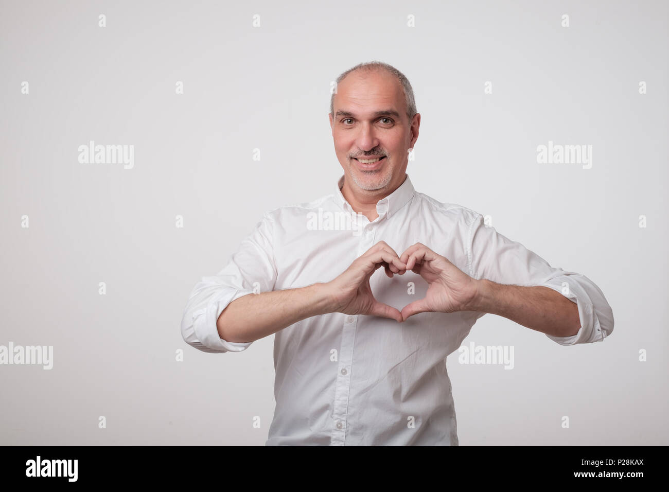 Man making heart gesture hi-res stock photography and images - Alamy