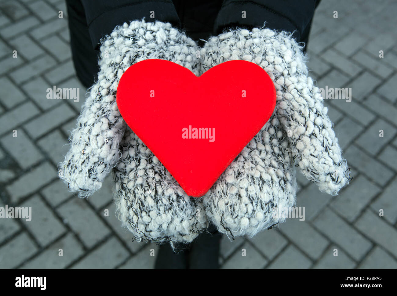 red heart sign in hands with mittens closeup Stock Photo - Alamy