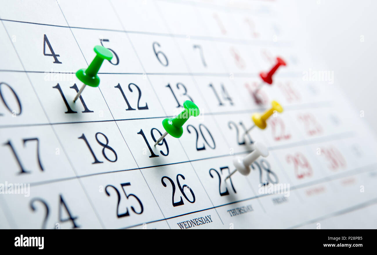 large wall calendar with number of days needles closeup Stock Photo - Alamy