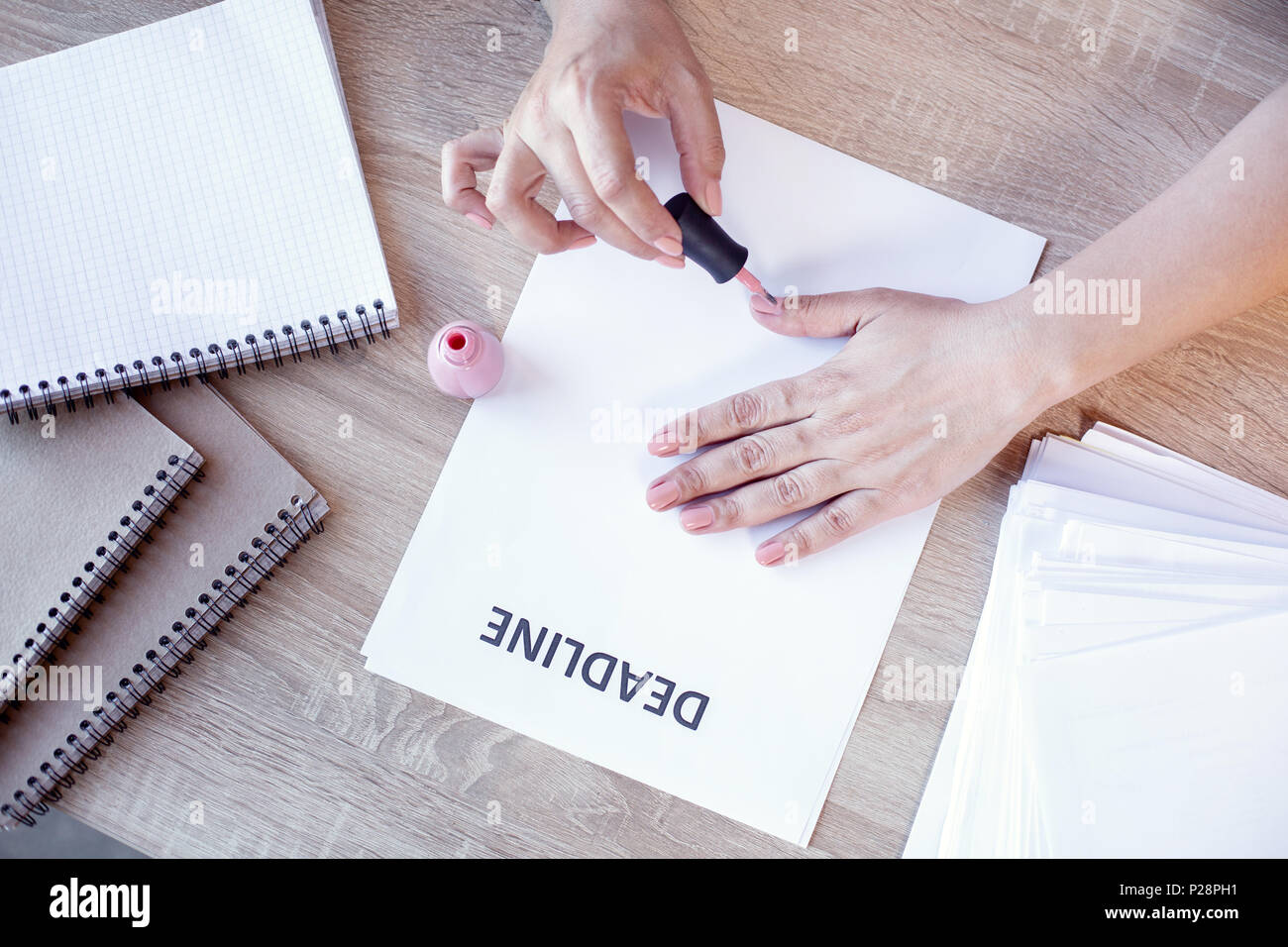 Beautiful female hands coloring nails Stock Photo - Alamy