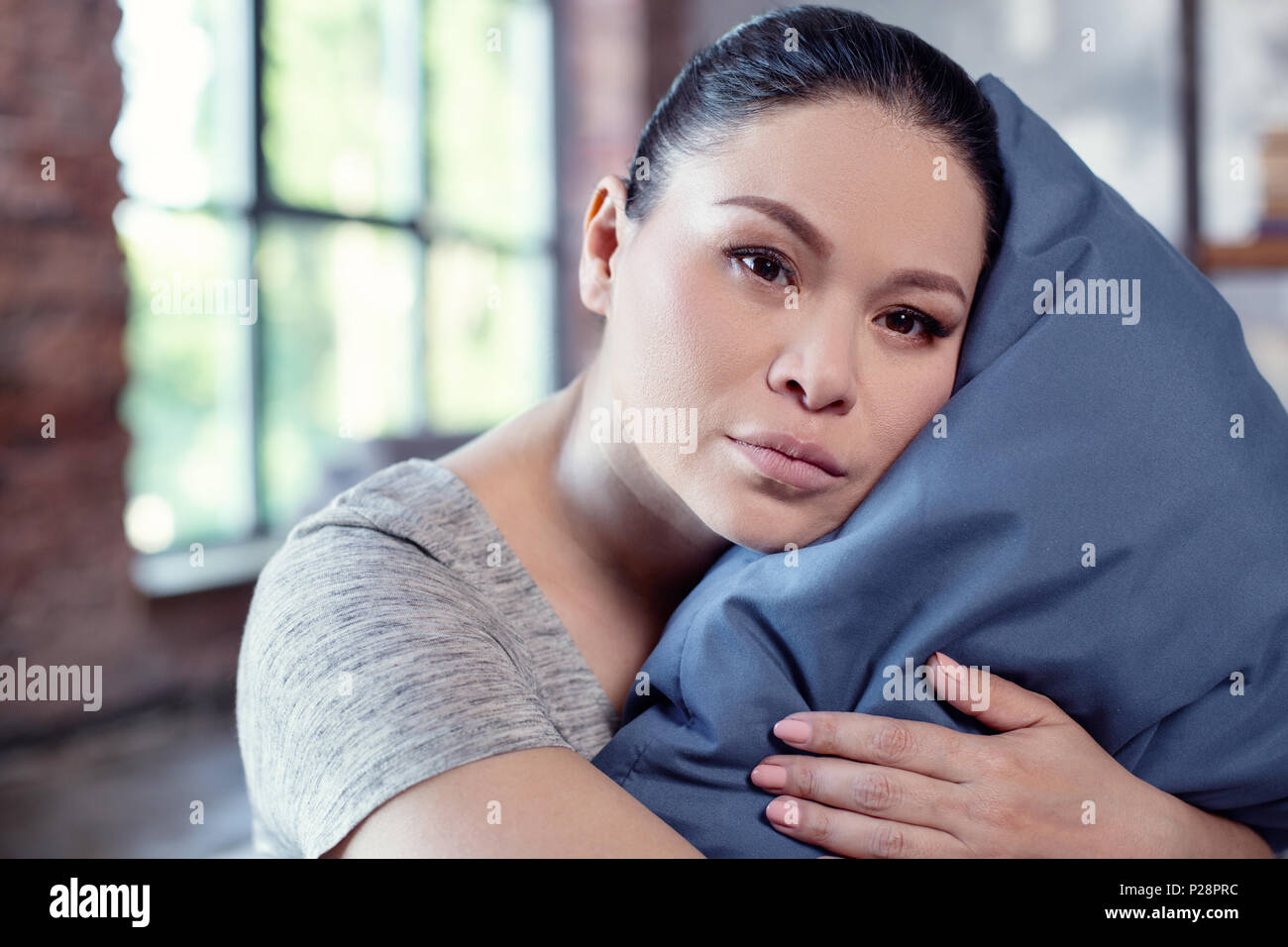 Attractive sad woman enduring sleep disorder Stock Photo - Alamy