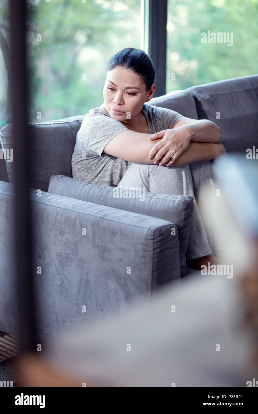 Sorrowful sad woman changing routine Stock Photo - Alamy