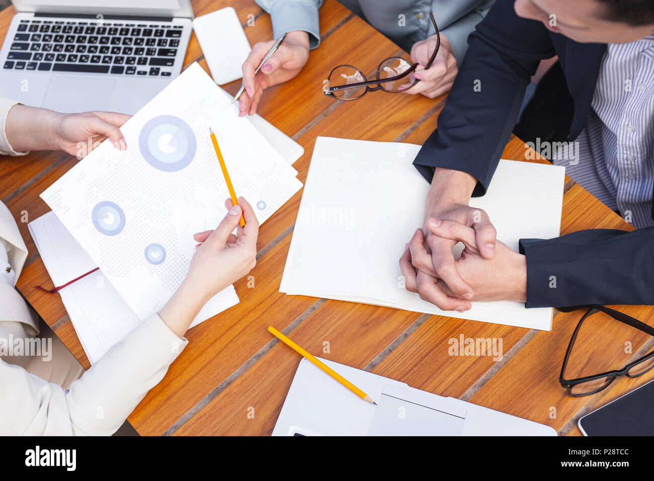 Business papers lying on the table near corporate leaders Stock Photo ...