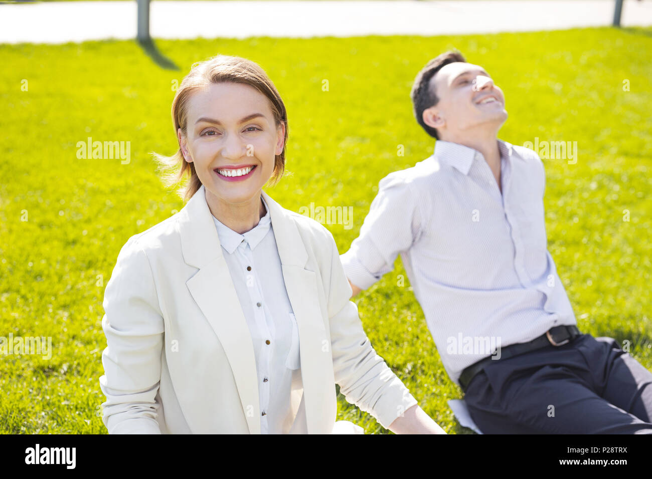 Smiling businesswoman with short haircut smiling broadly Stock Photo ...