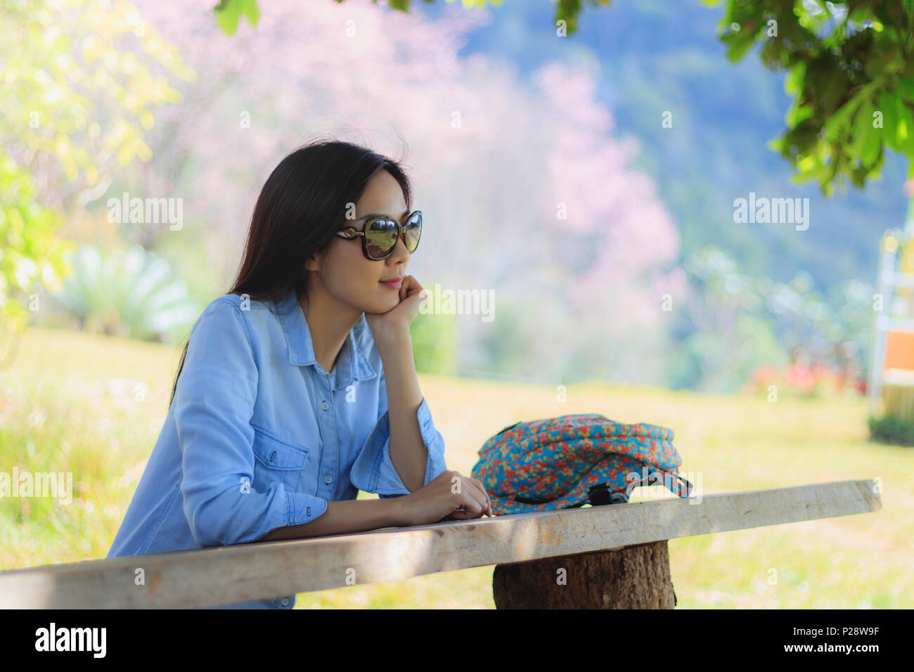Women relax in the sun and enjoy the forest Stock Photo - Alamy