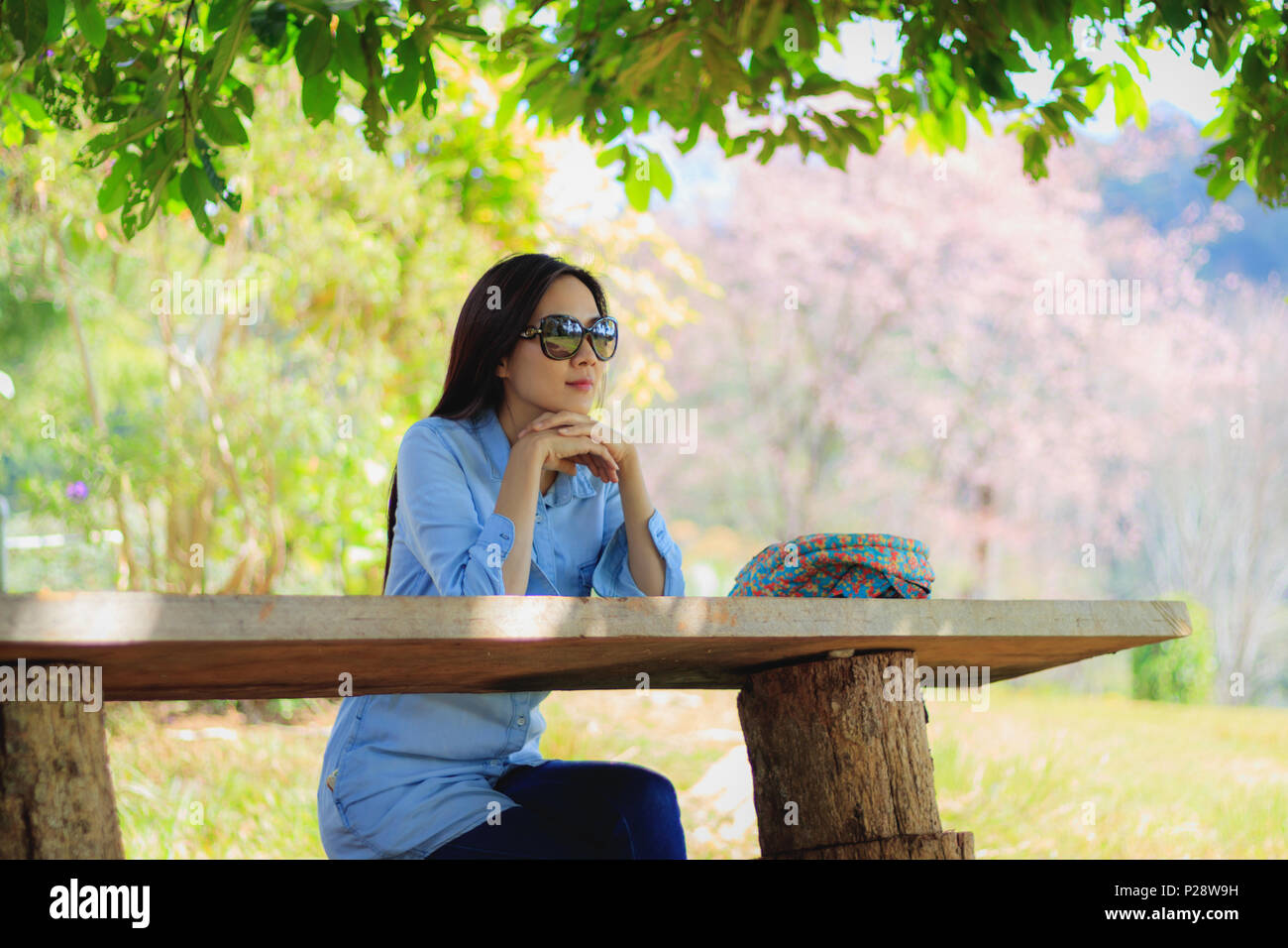 Women relax in the sun and enjoy the forest Stock Photo - Alamy
