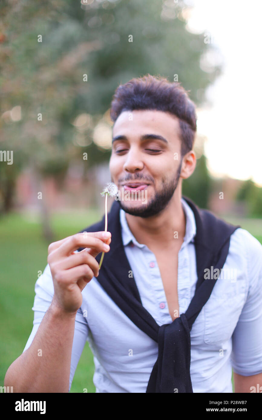 Portrait young man blowing lips hi-res stock photography and images - Alamy