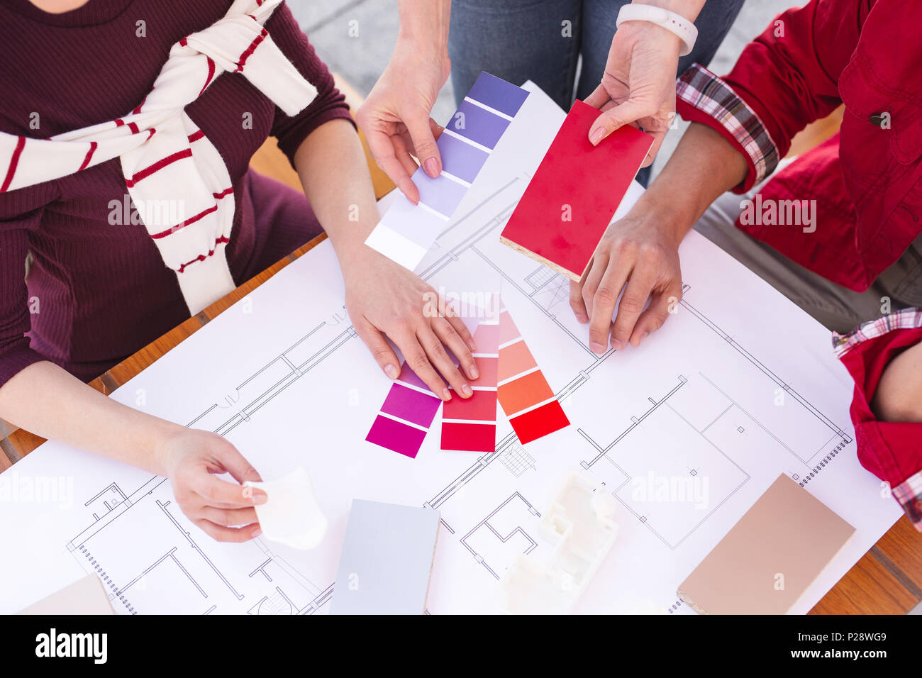 Married couple choosing color palette for their apartment Stock Photo ...