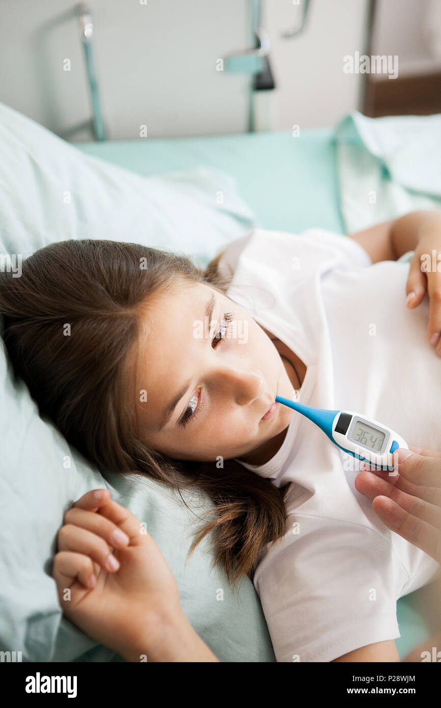 Doctor taking body temperature of her patient Stock Photo - Alamy
