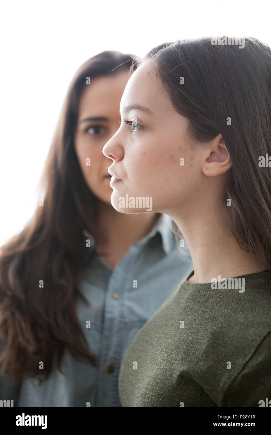 Two sisters standing together isolated hi-res stock photography and ...