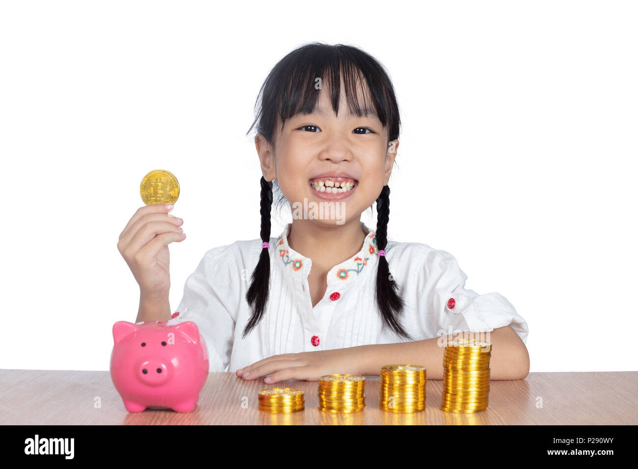 Asian Chinese little girl holding golden Bitcoin in isolated white ...