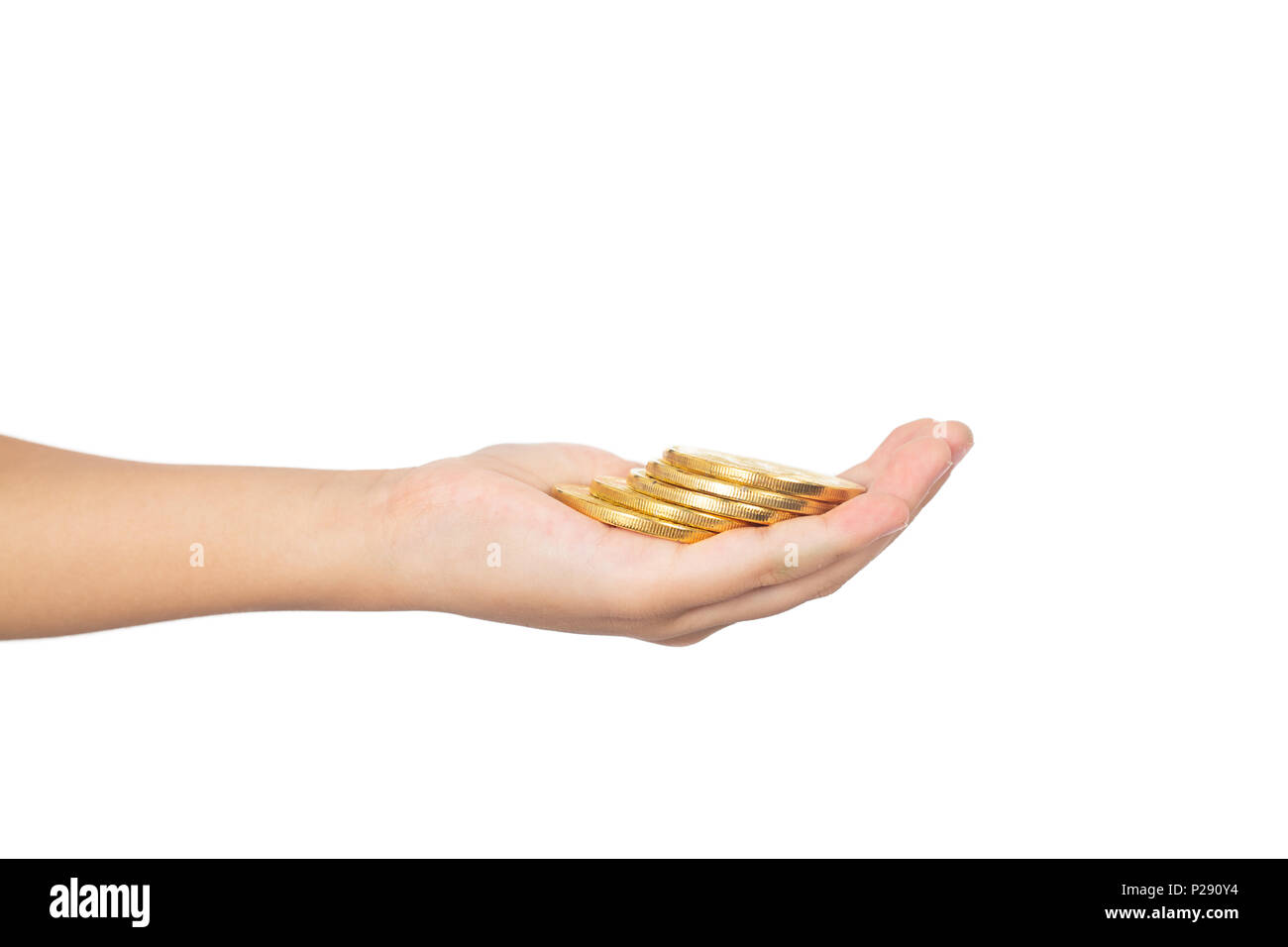 Children's hand holding golden Bitcoin in isolated white background ...