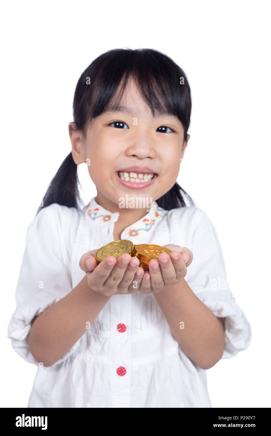 Asian Chinese little girl holding golden Bitcoin in isolated white ...