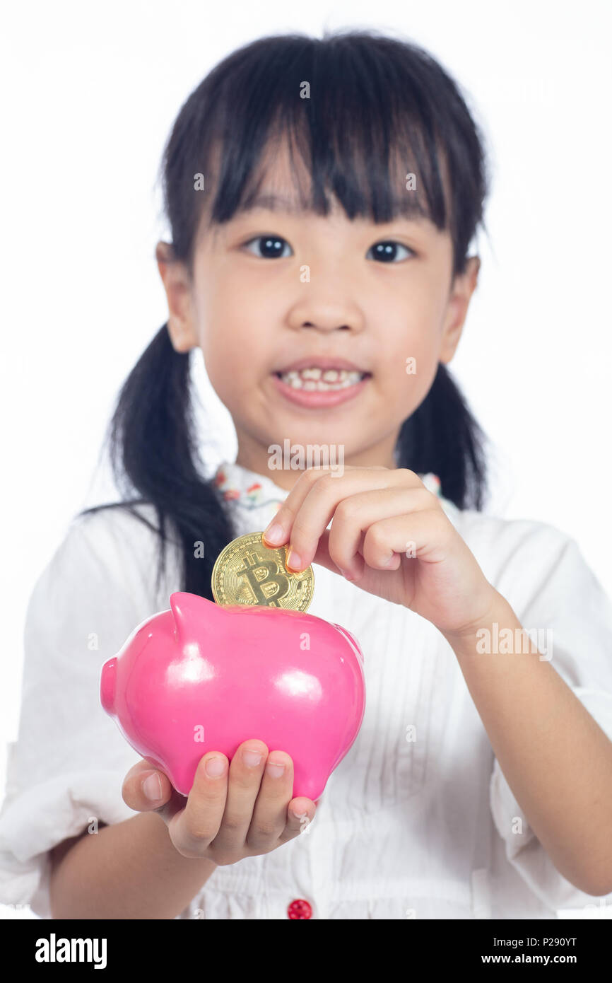 Asian Chinese little girl holding golden Bitcoin in isolated white ...